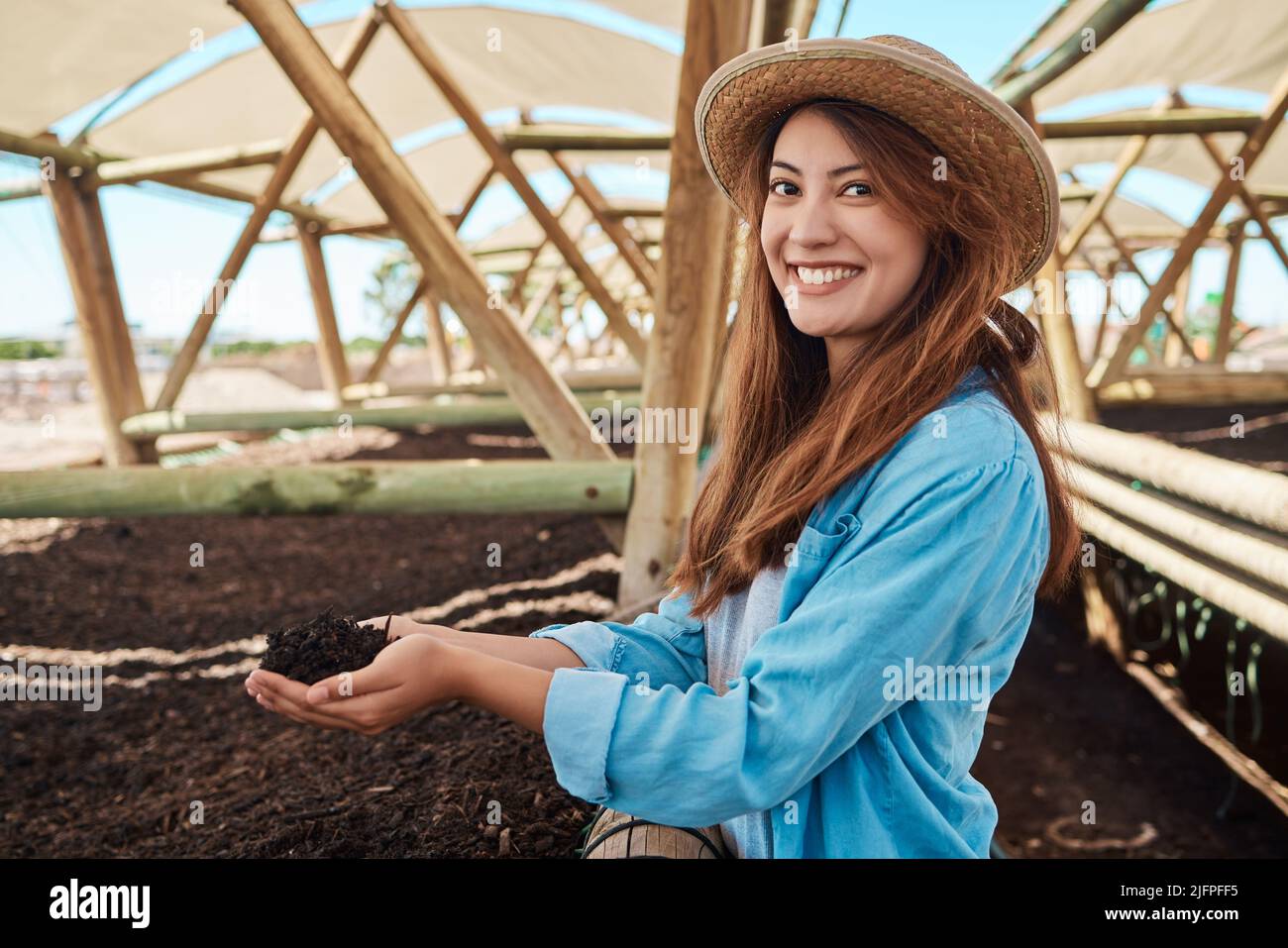 This soil is optimum for growing healthy crops. Portrait of a young ...