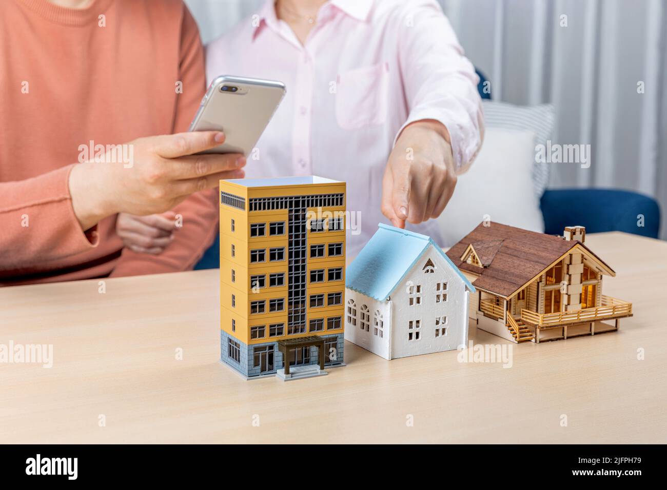 real estate contract hand motion comparing houses with smartphones ...