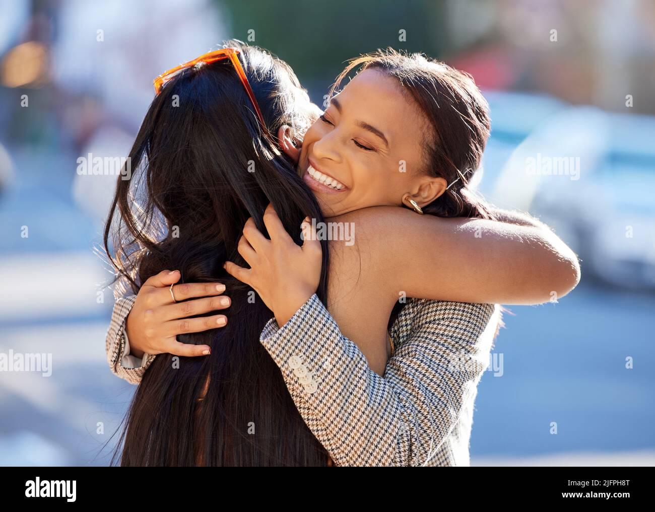 How long has it been. Cropped shot of two attractive young girlfriends ...