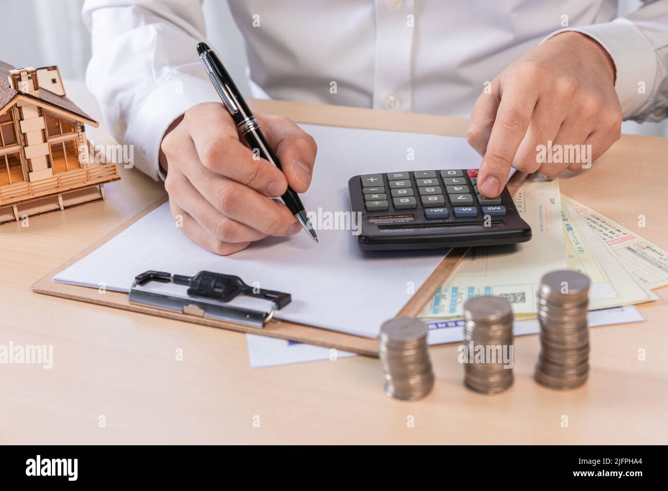 real estate contract hand motion calculating bills and costs Stock ...