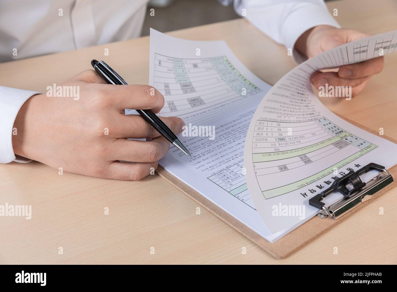 real estate contract hand motion signing contract Stock Photo - Alamy