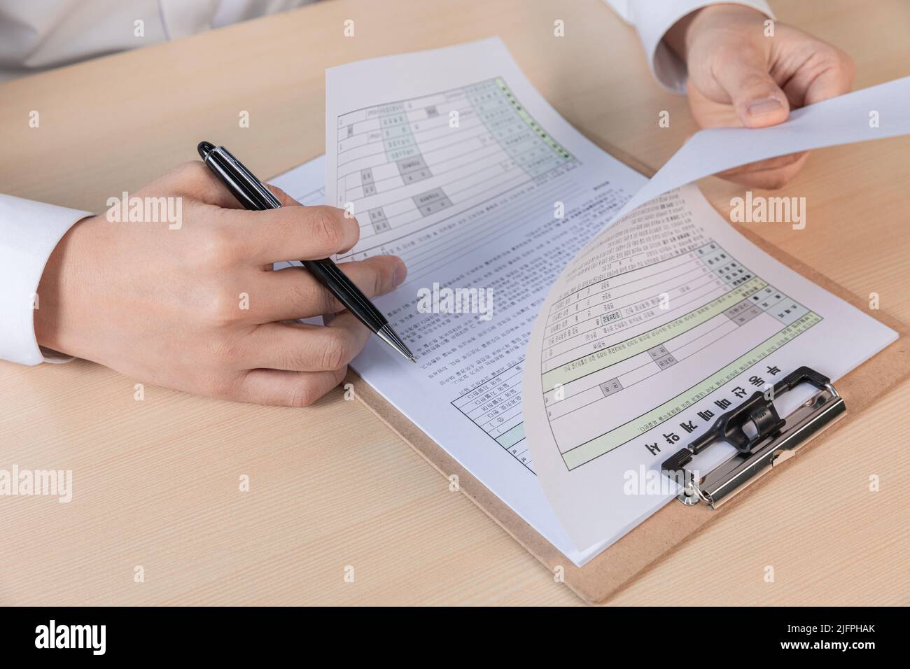 real estate contract hand motion signing contract Stock Photo - Alamy