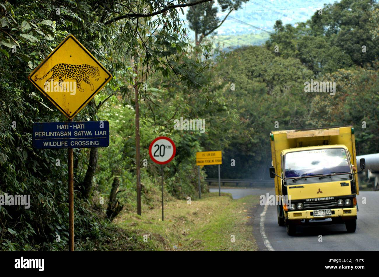 Wildlife crossing signage with a drawing of Javan leopard (Panthera ...
