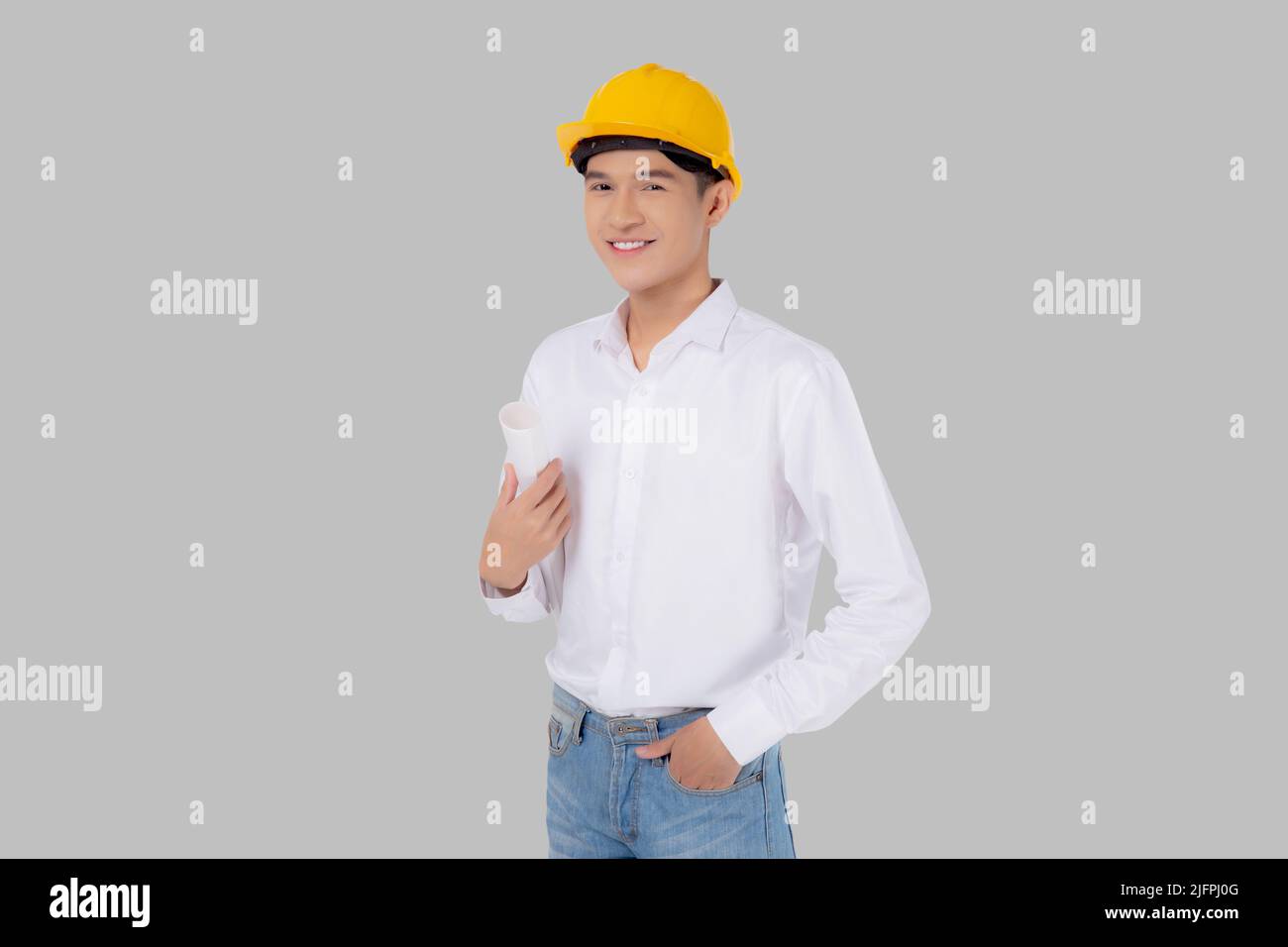 Portrait young asian man is engineer wearing helmet standing and ...