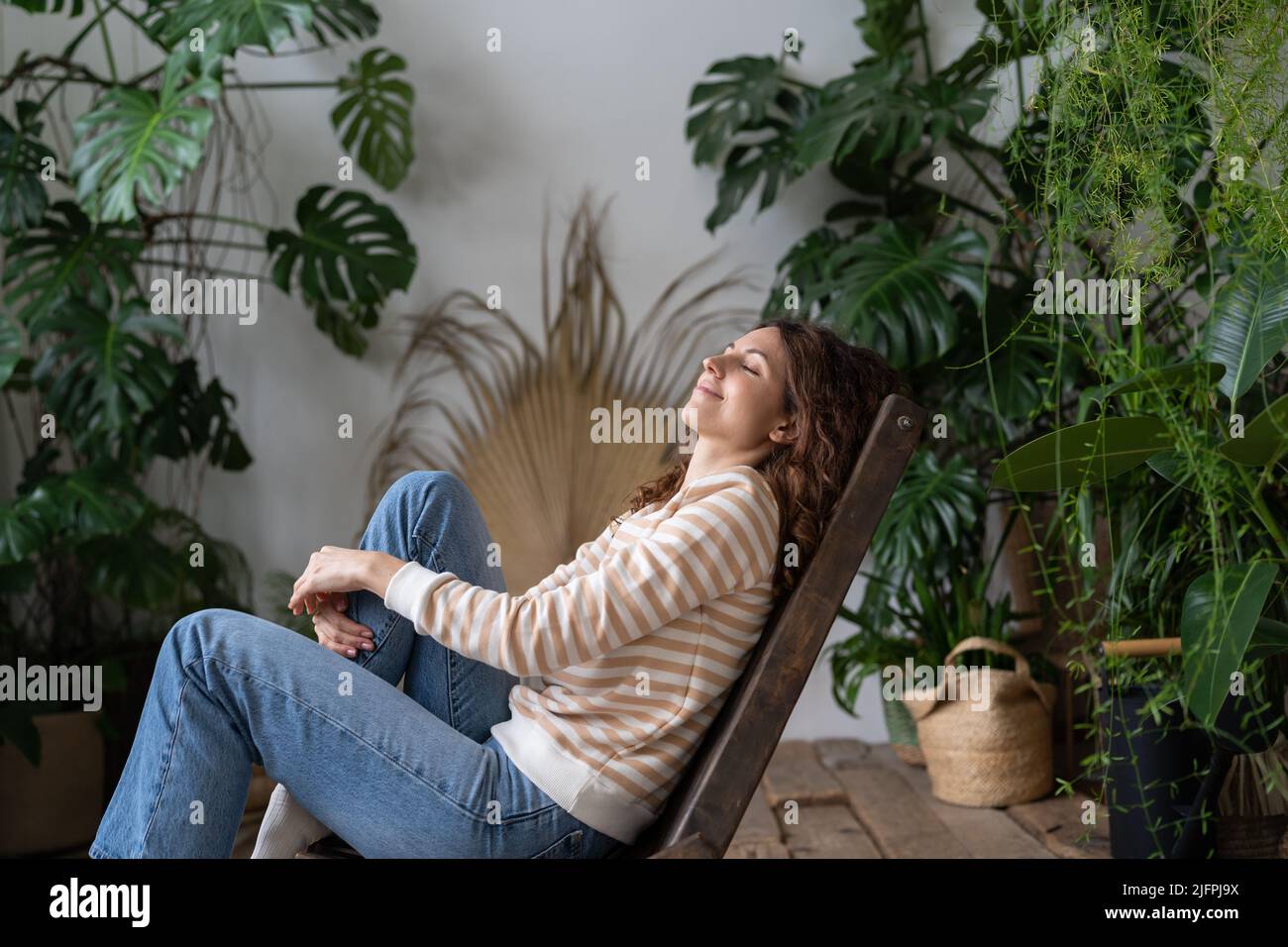 Happy calm peaceful woman dreaming with closed eyes and smile on face ...