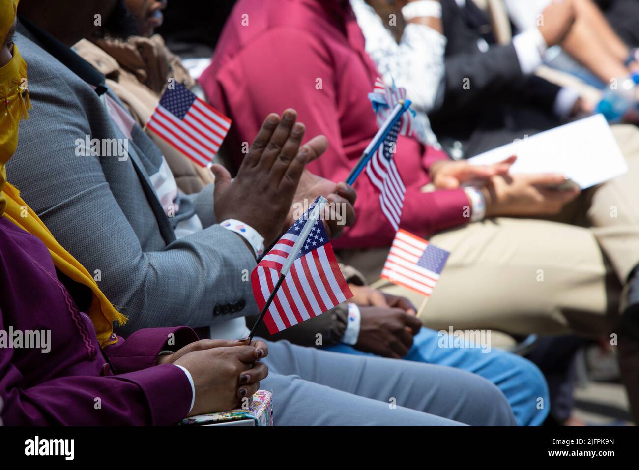 Seattle, Washington, USA. 4th July, 2022. Applicants holding American ...
