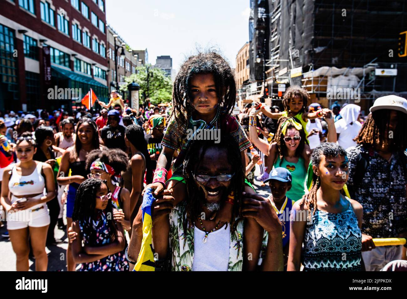 The crowd of revelers following the Carifiesta parade. Since 1975 the ...