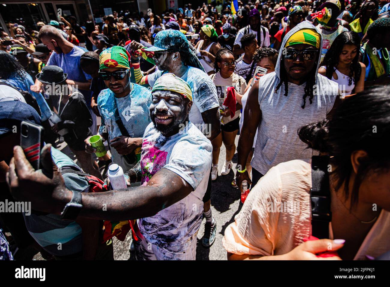 The crowd of revelers following the Carifiesta parade. Since 1975 the ...