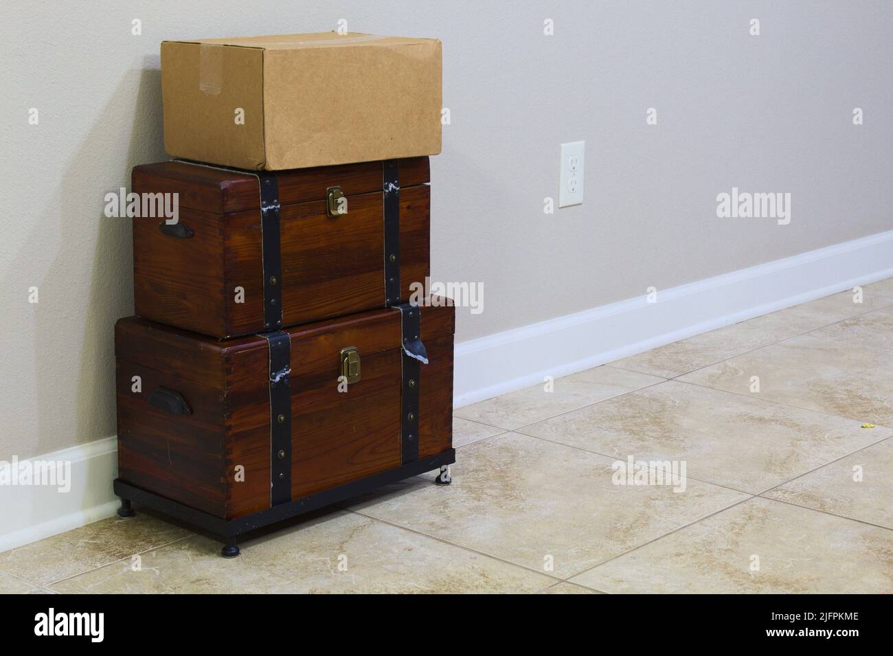 cardboard box on wooden chests Stock Photo - Alamy