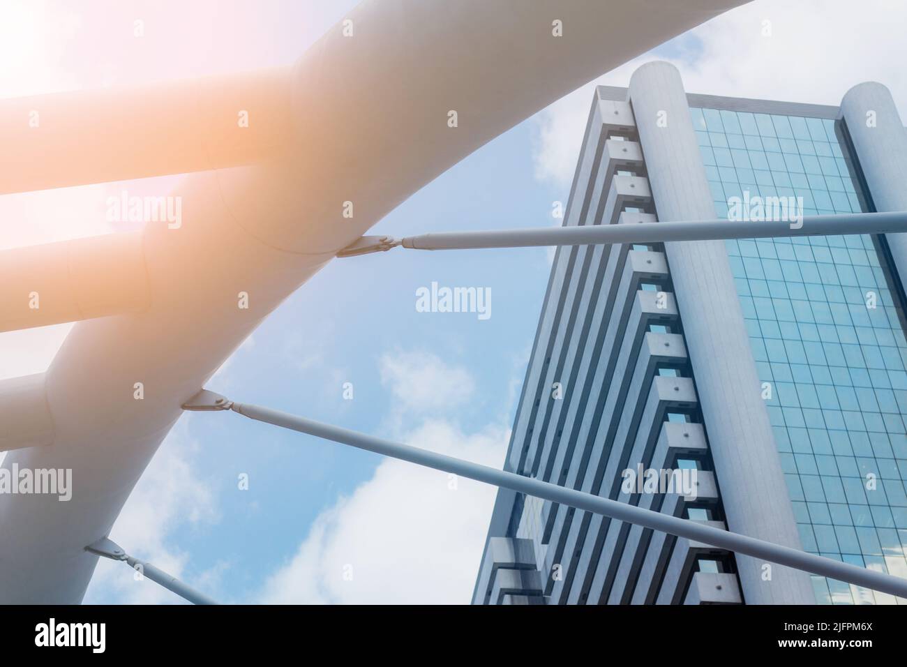 Bridge and office building with the sunlight Stock Photo - Alamy