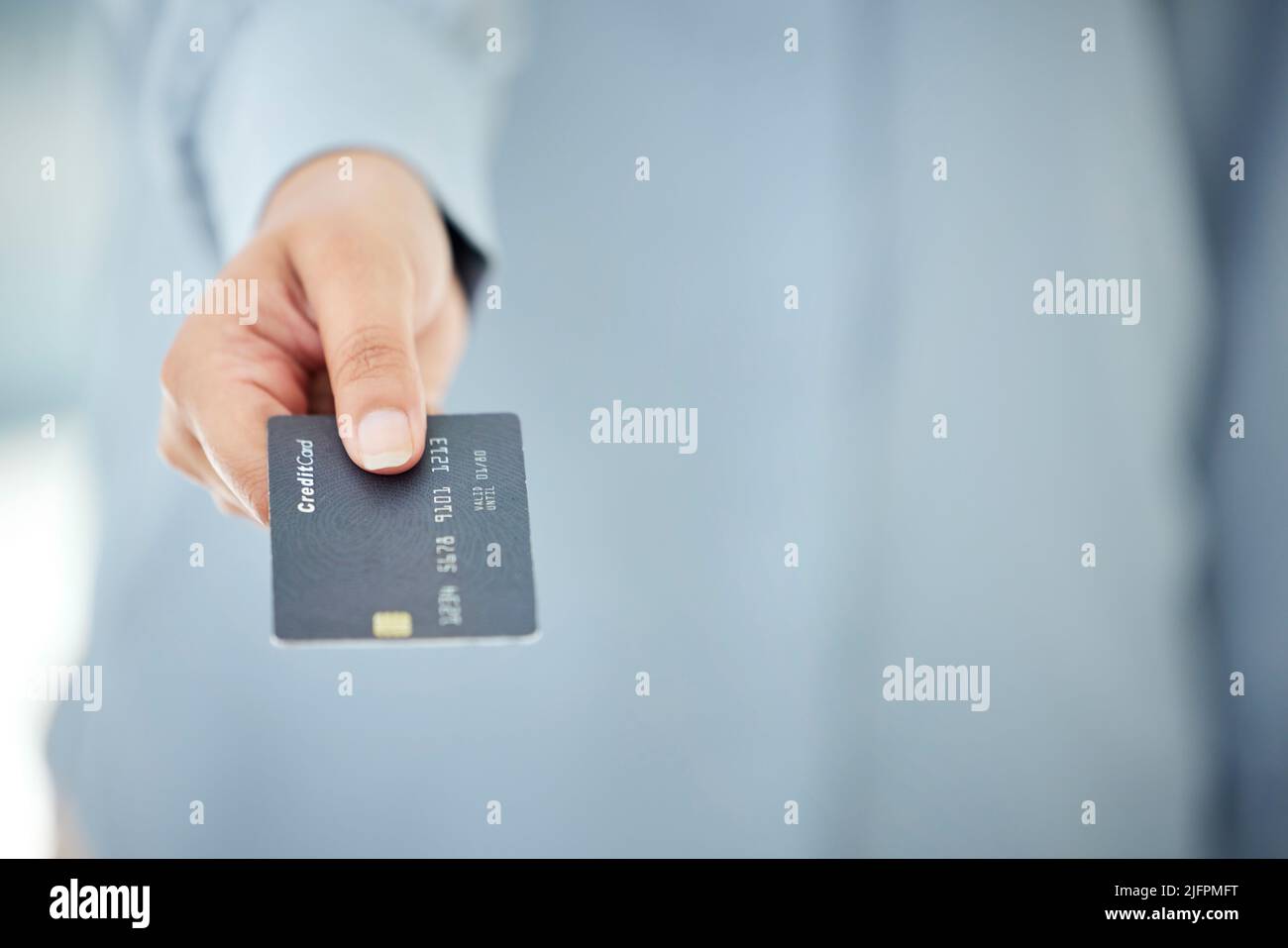 The easiest way to pay. Cropped shot of an unrecognizable businesswoman holding out her credit ...