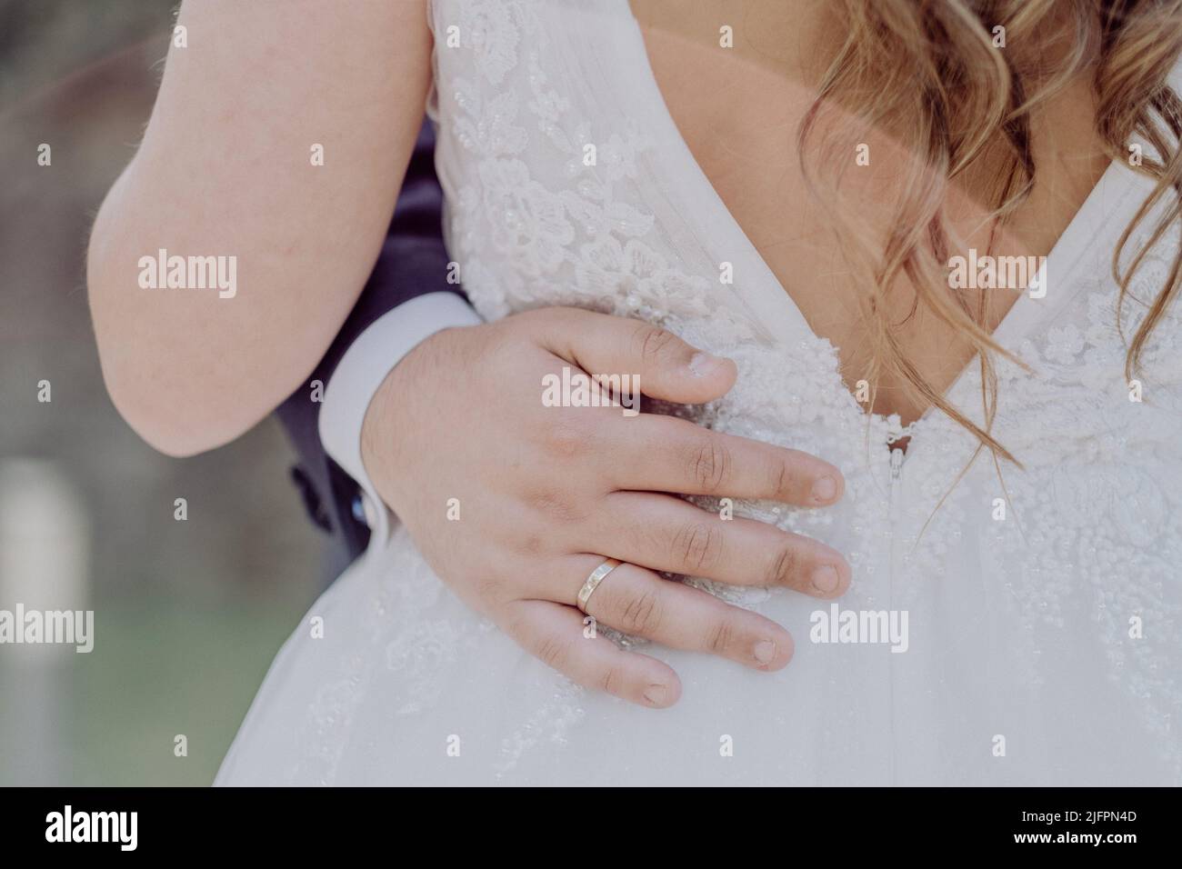 Cute bride and groom hugging Stock Photo - Alamy