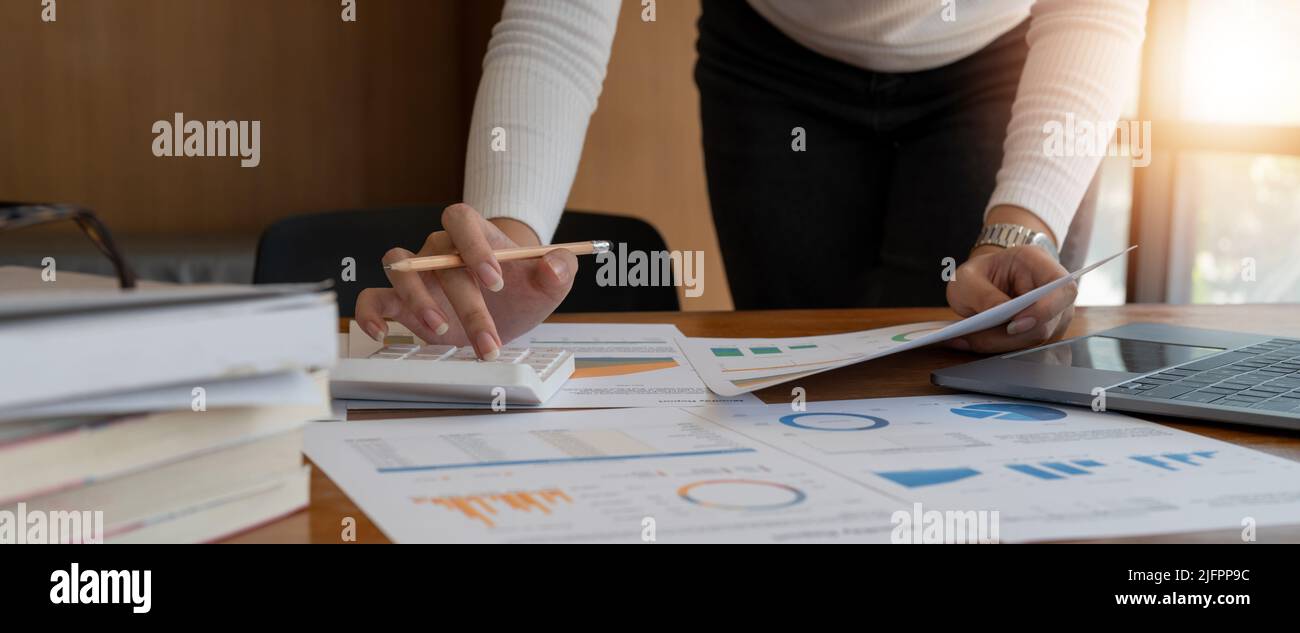 Close up of businesswoman or accountant working on calculator to ...
