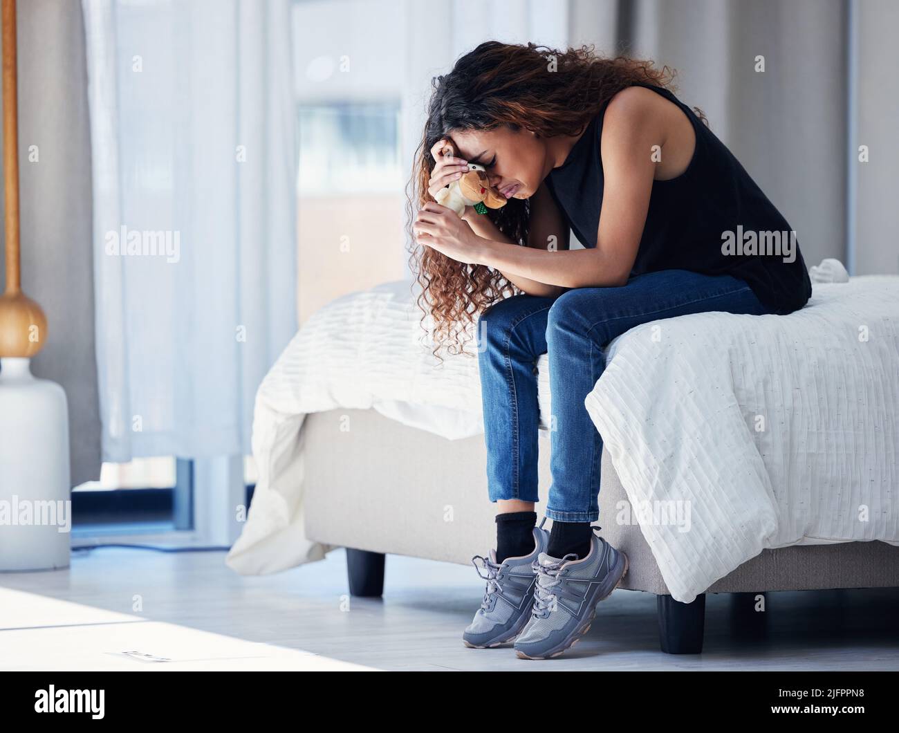 Woman sad home alone teddy bear hi-res stock photography and images - Alamy