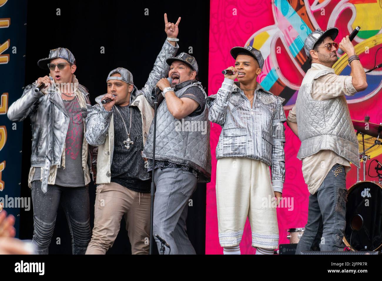 The cast of '& Juliet the West End Musical, in full costume as 'De Bois Band' performs on stage ...