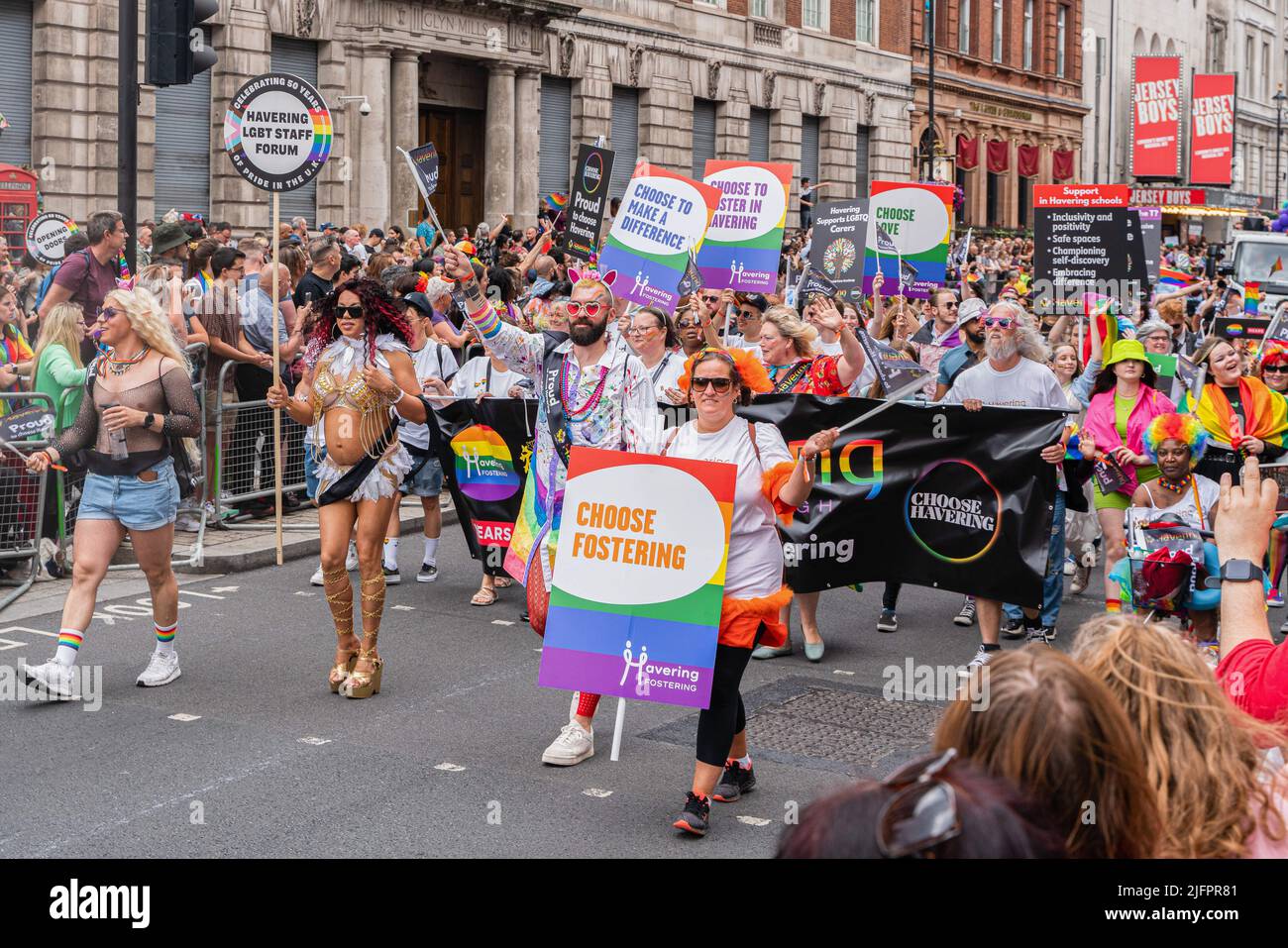 LGBT participants march with placards and banners during the Pride ...