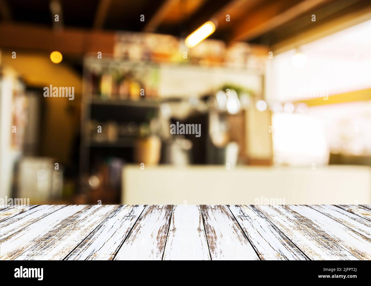 Coffee shop blur background with bokeh image and white wooden table ...