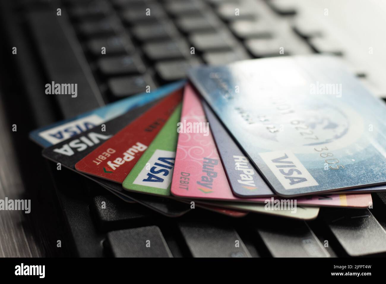 Selective focus on a group of credit and debit cards placed on a ...