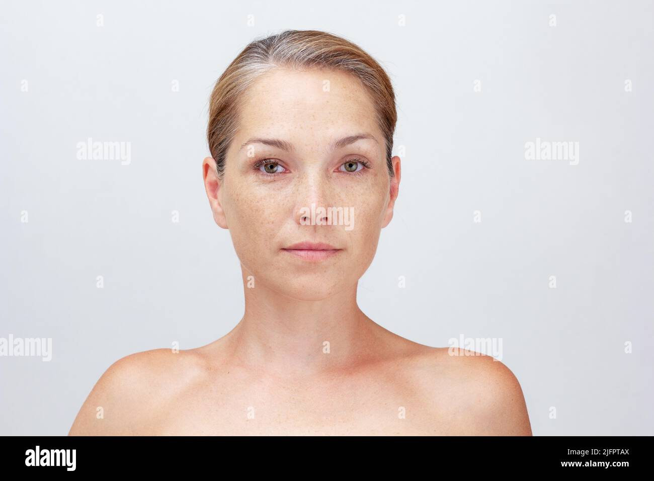 Portrait of caucasian middle aged beautiful woman of 40s with grey hair ...