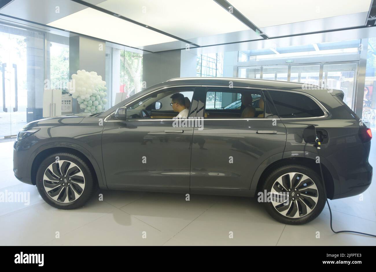 HANGZHOU, CHINA - JULY 5, 2022 - A user experiences huawei's AITO M7 at ...