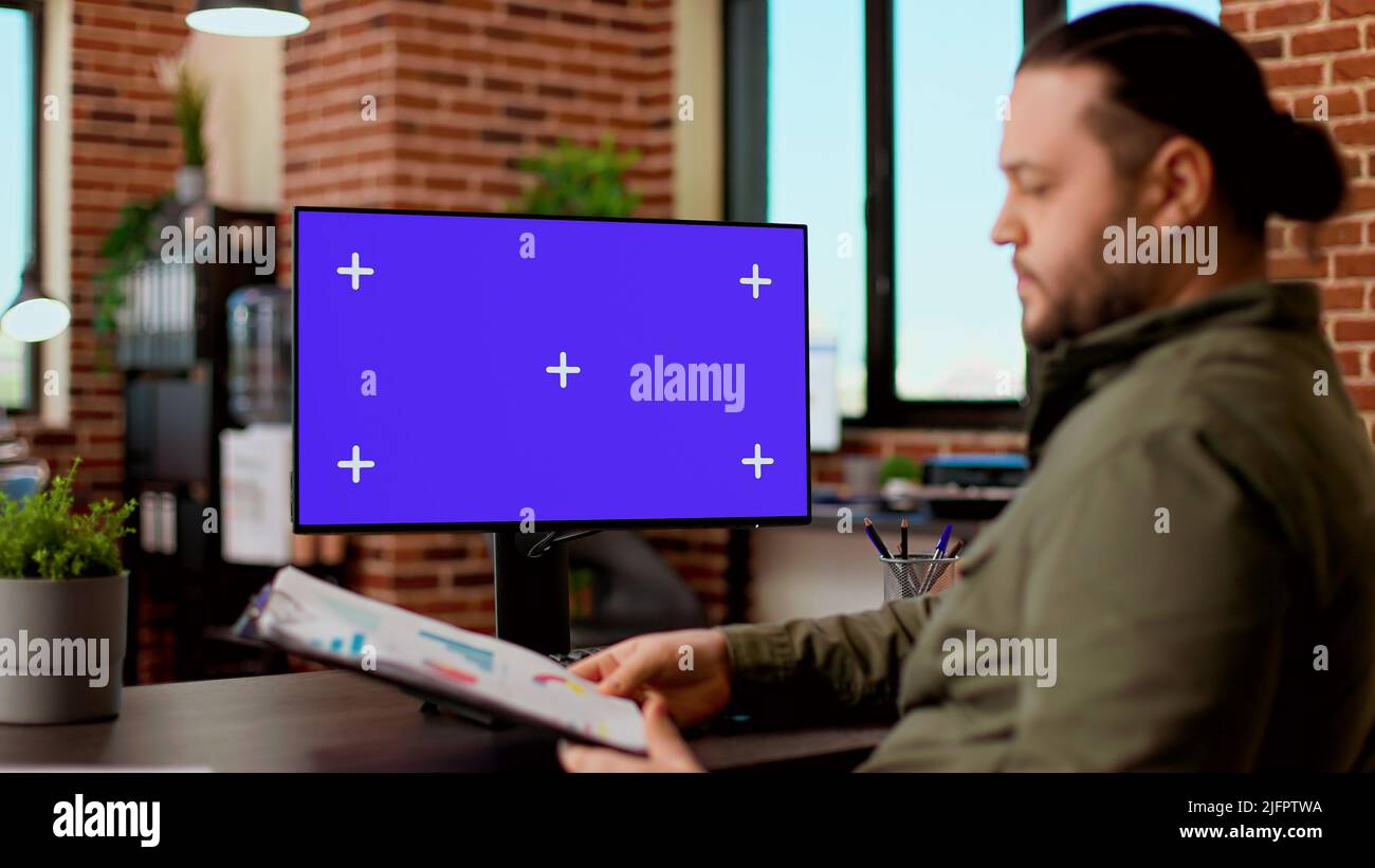 Corporate Worker Typing On Computer With Greenscreen Monitor Working With Blank Chroma Key