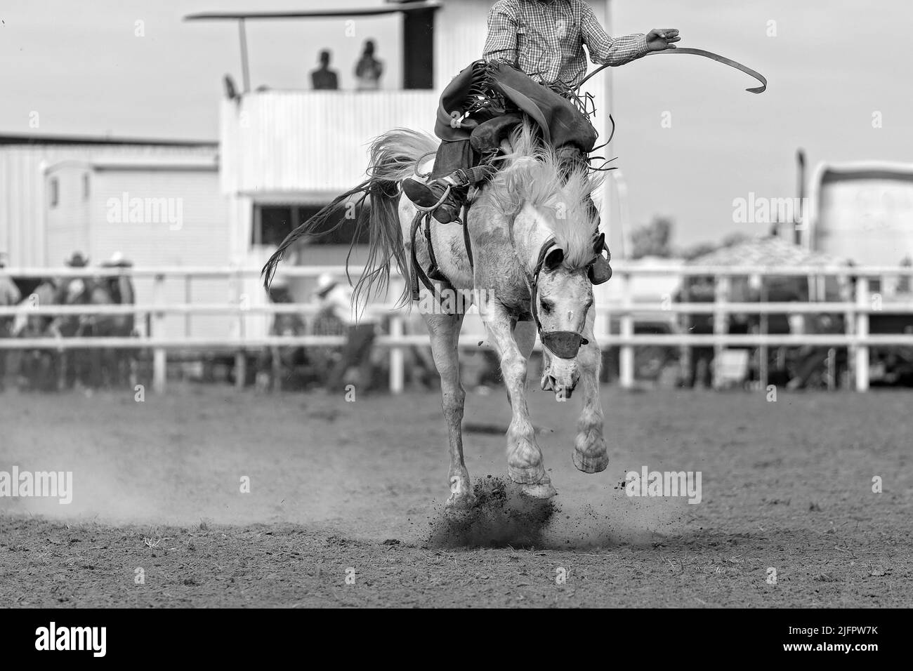 Cowboy riding a bucking bronc at a country rodeo Australia Stock Photo ...