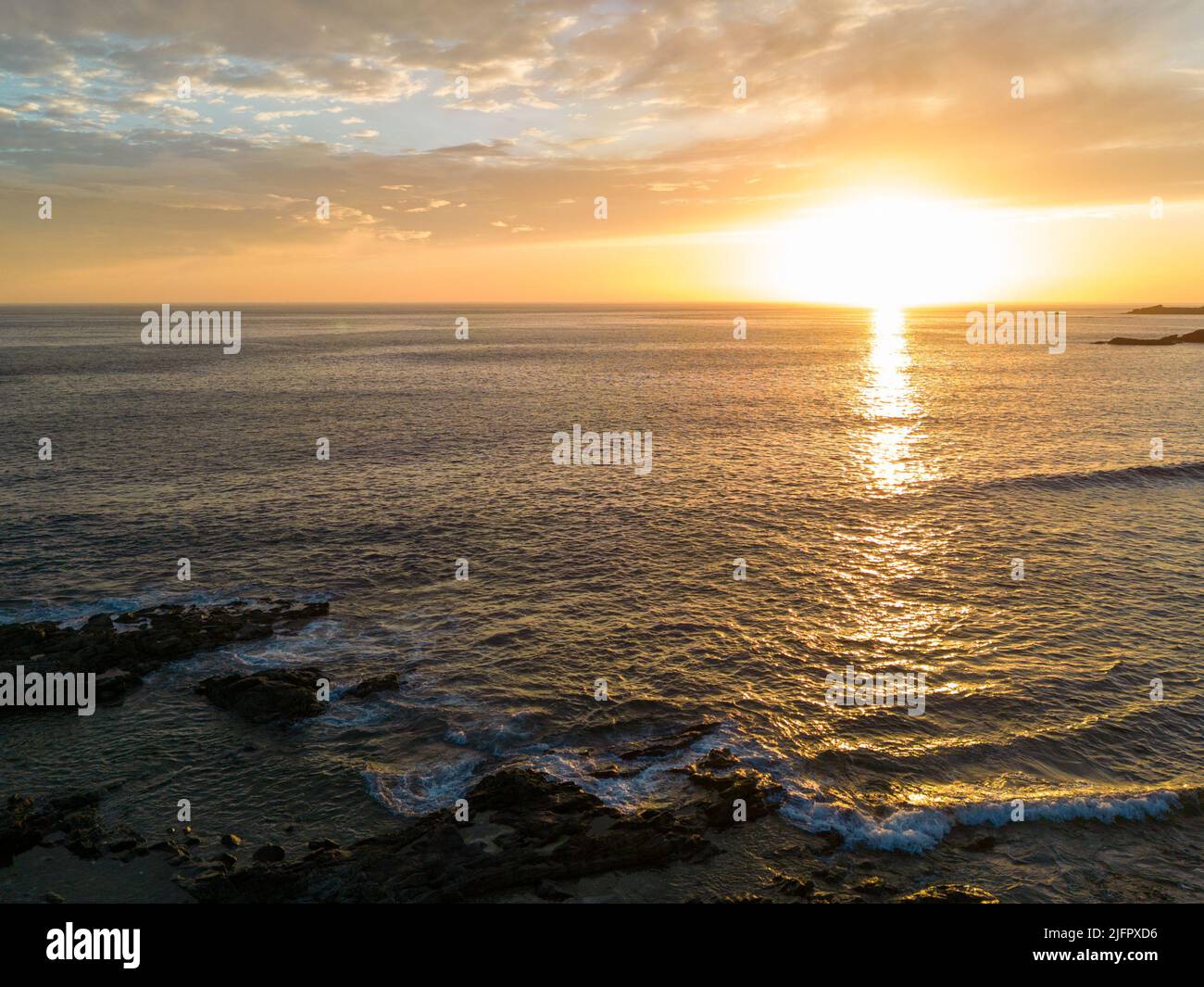 A natural landscape of a sea at sunset Stock Photo - Alamy