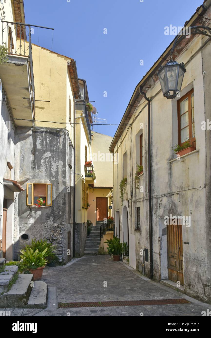 A vertical of a narrow street and old houses in Aieta village, the ...