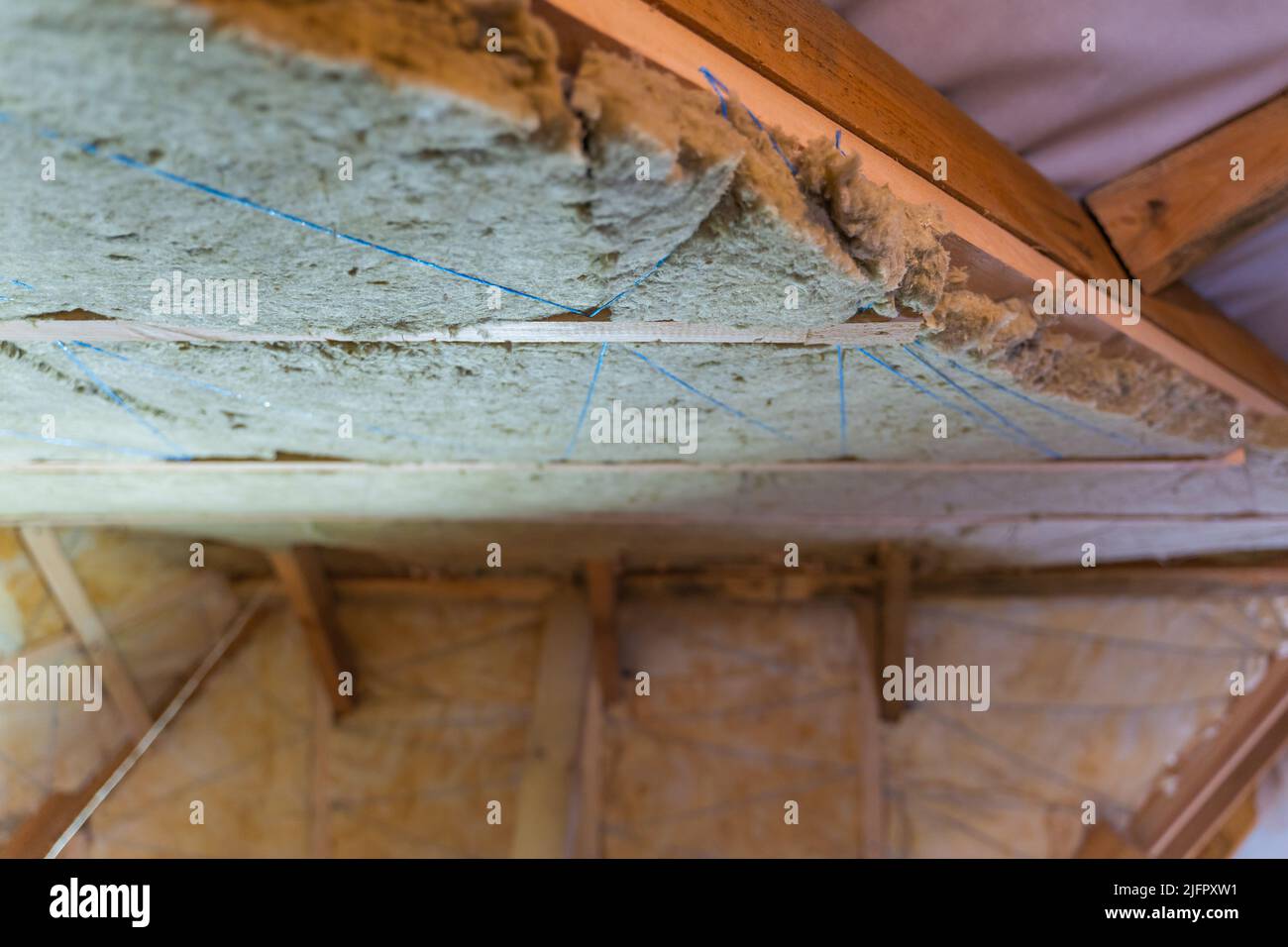 The roof is insulated with mineral wool. Insulation hemming with thread ...