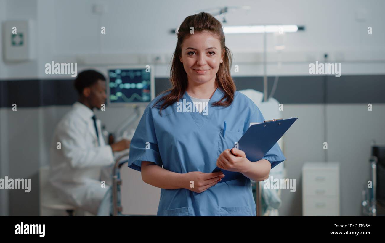 Portrait of woman nurse with medical files to give support to medic in ...