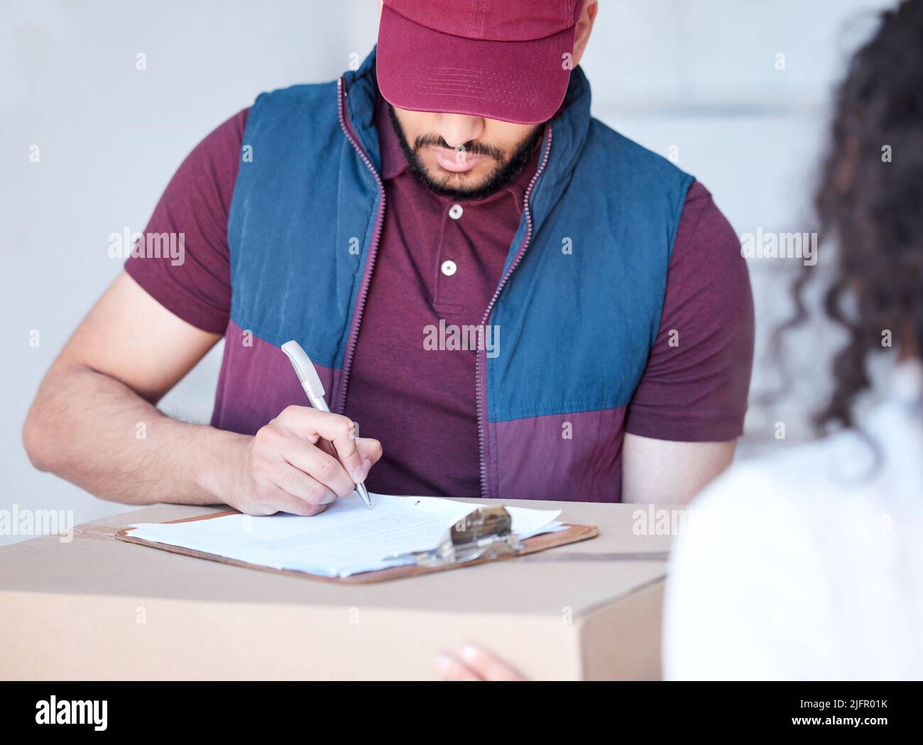 Finishing up the paperwork. Cropped portrait of a handsome young male ...