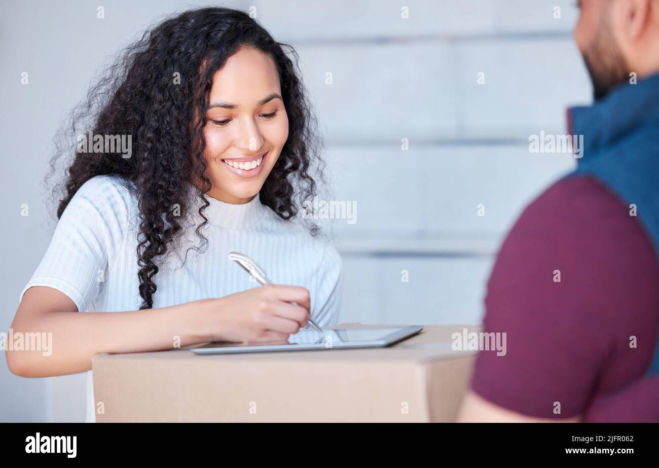 One signature and youre done. Cropped shot of an attractive young woman ...