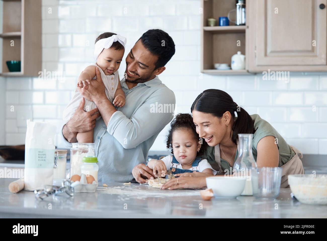 Mom is the best baker. Shot of a woman baking in the kitchen with her ...