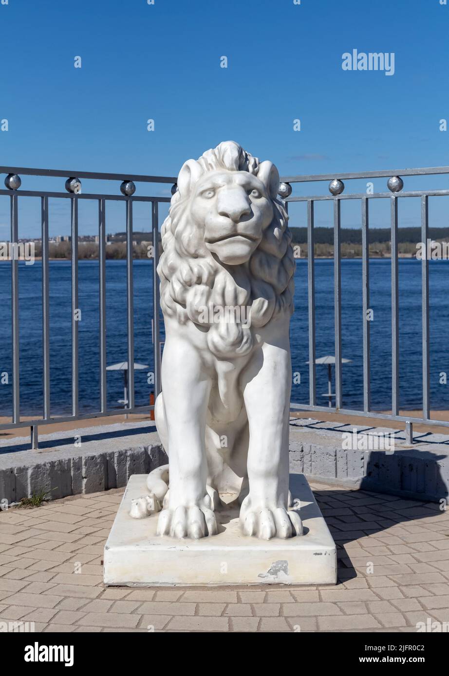 Iron statue of a lion on the city embankment Stock Photo - Alamy