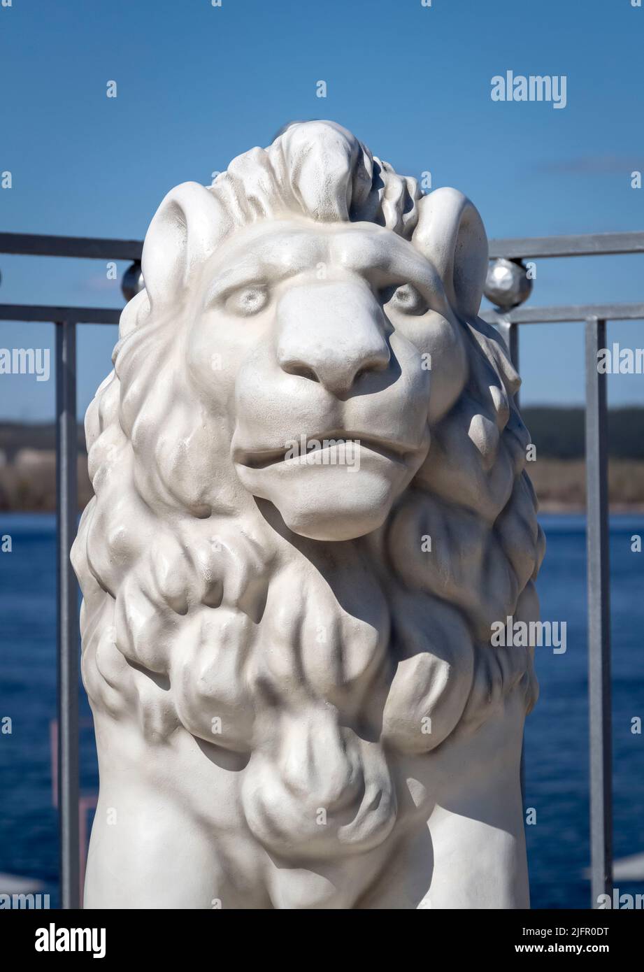 Iron statue of a lion on the city embankment Stock Photo - Alamy