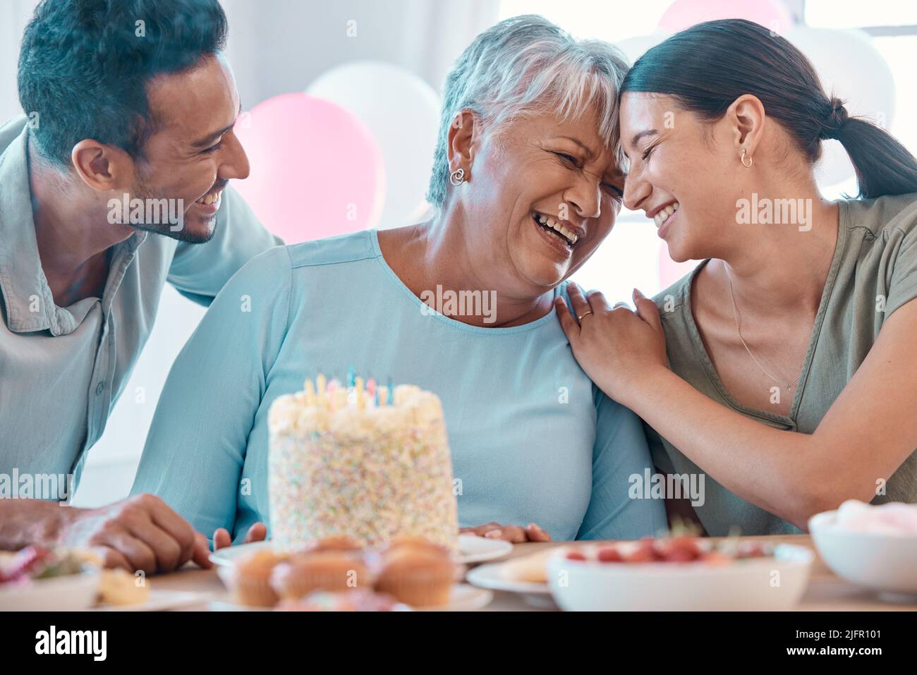 Our darling mom. Shot of two young adults celebrating a birthday with a ...