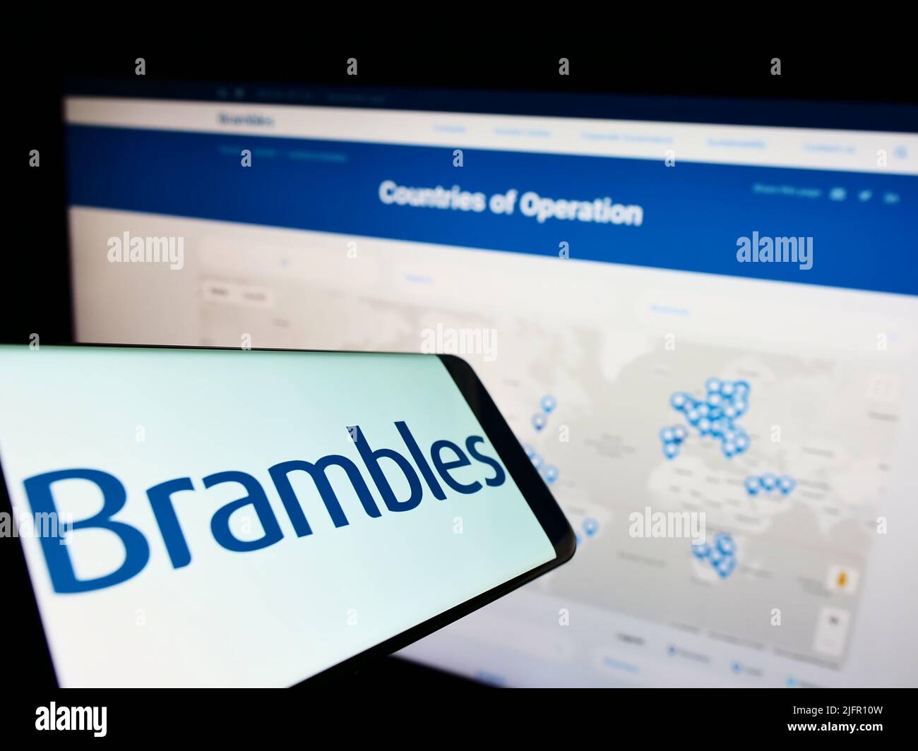 Mobile phone with logo of Australian services company Brambles Limited ...