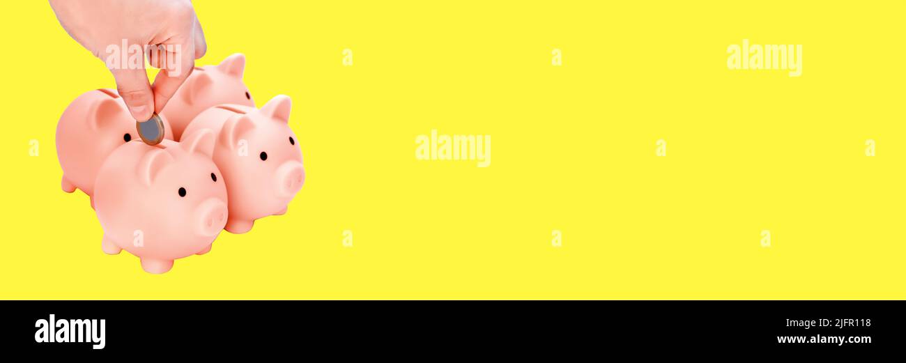 Hand putting coins to piggi bank. Four pink piggy banks isolated on ...