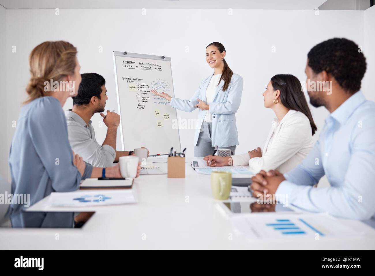 Presenting the plan. Cropped shot of an attractive young businesswoman ...