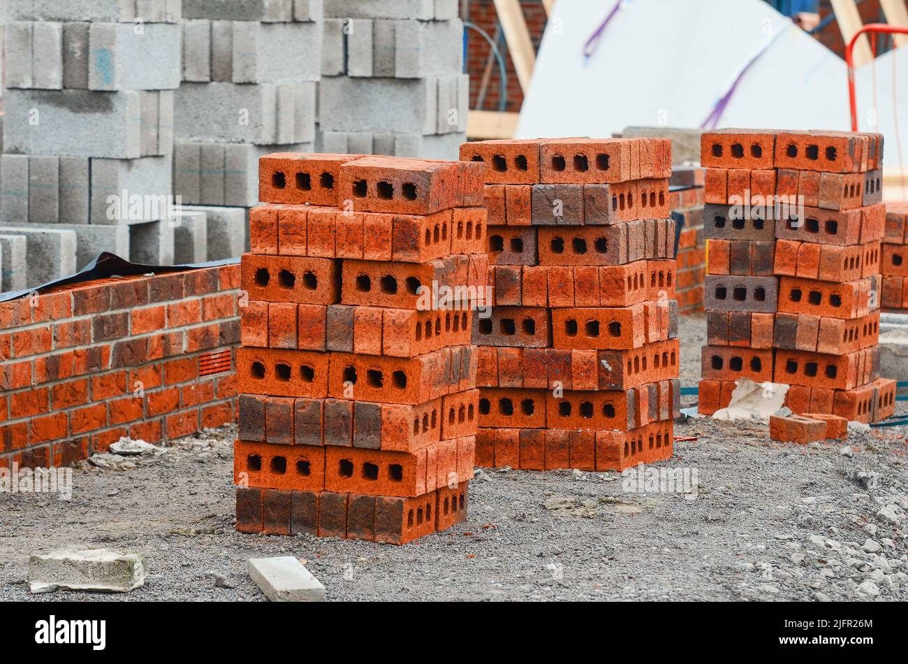 Red bricks and concrete blocks delivered on construction site and ...