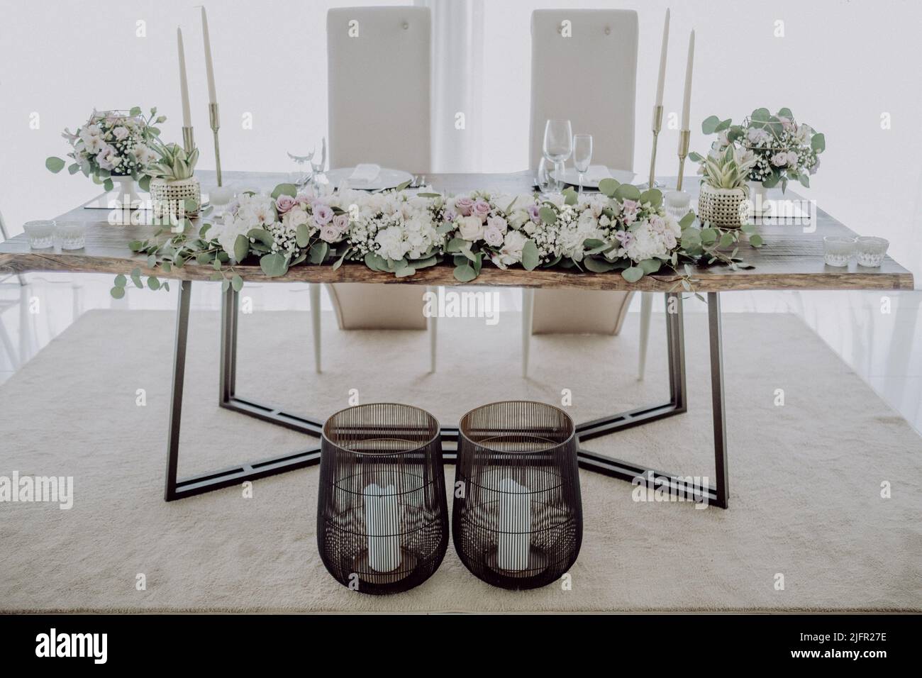 A look at the decorated wedding party head table -floral centerpiece ...