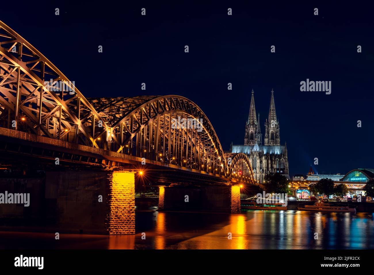 GERMANY, COLOGNE- JUNE, 24, 2022: THE RHINE EMBANKMENT AT NIGHT the ...