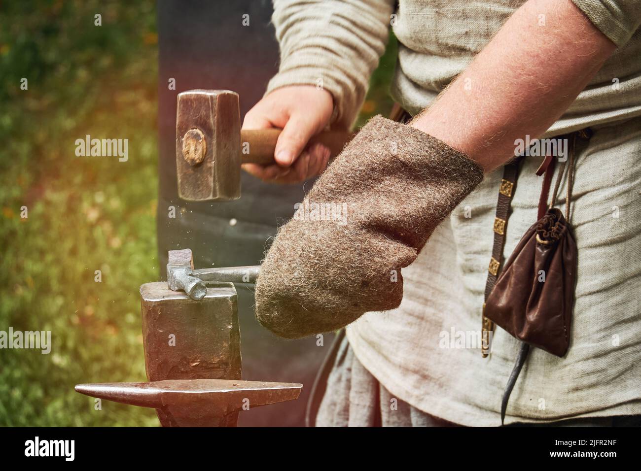 Work of a medieval blacksmith for the manufacture of metal products ...