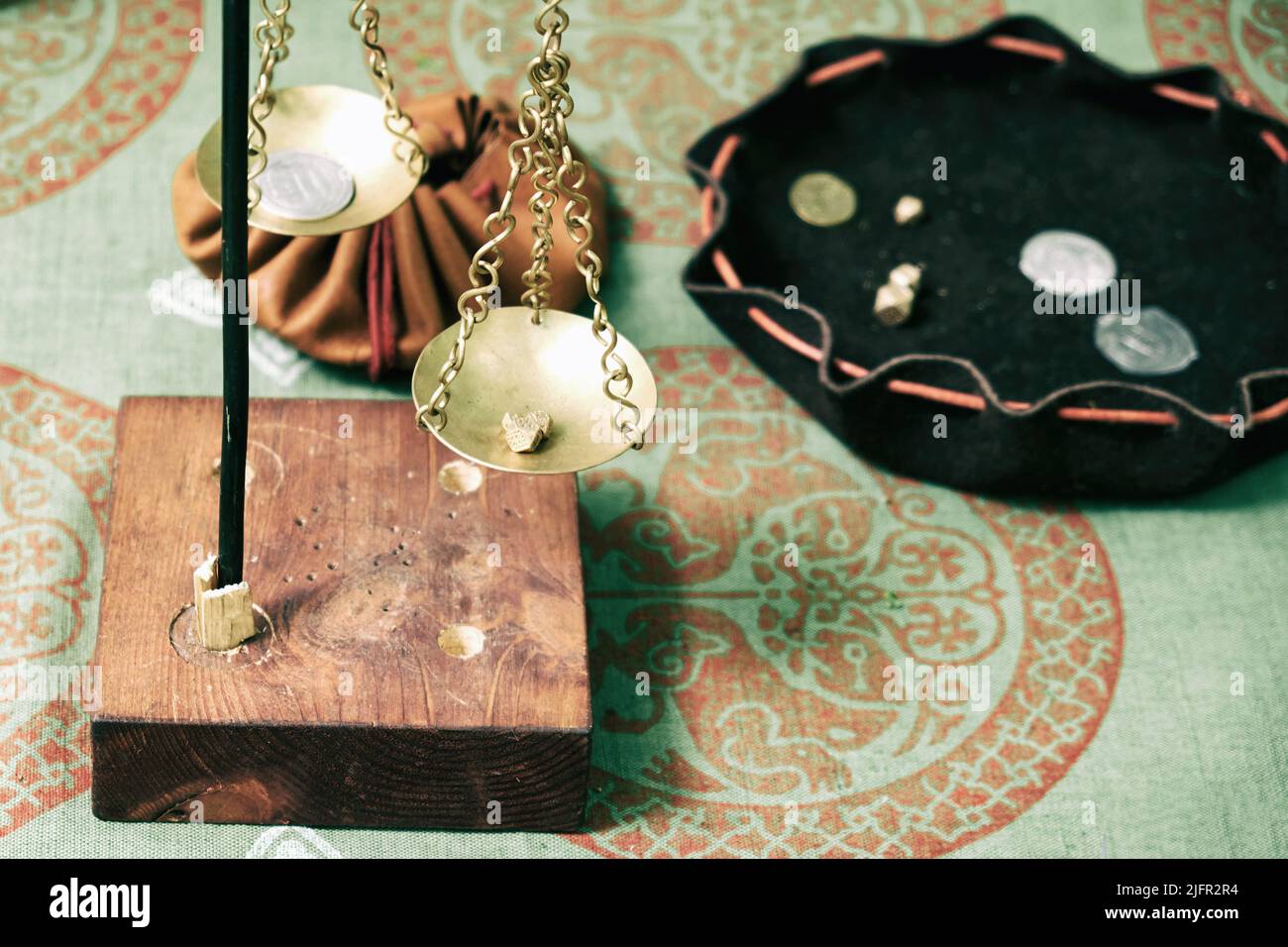 Production of medieval coins by casting and forging. Reconstruction of ...