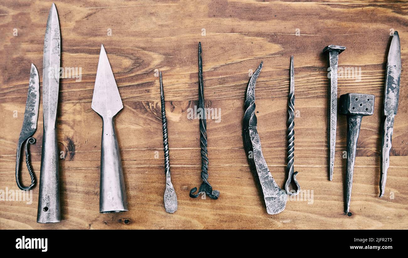 Medieval vintage weapon omn wooden table. Reconstruction of the events ...