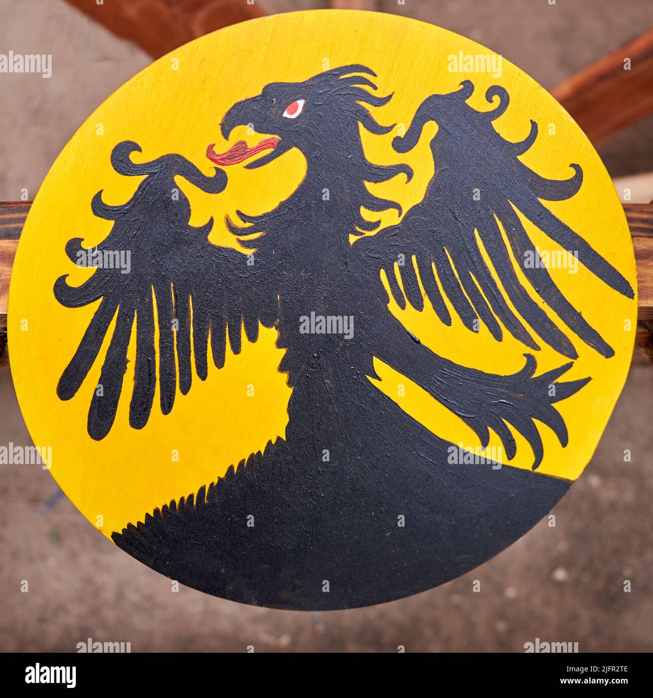 Yellow vintage shield with an black eagle a medieval warrior ...