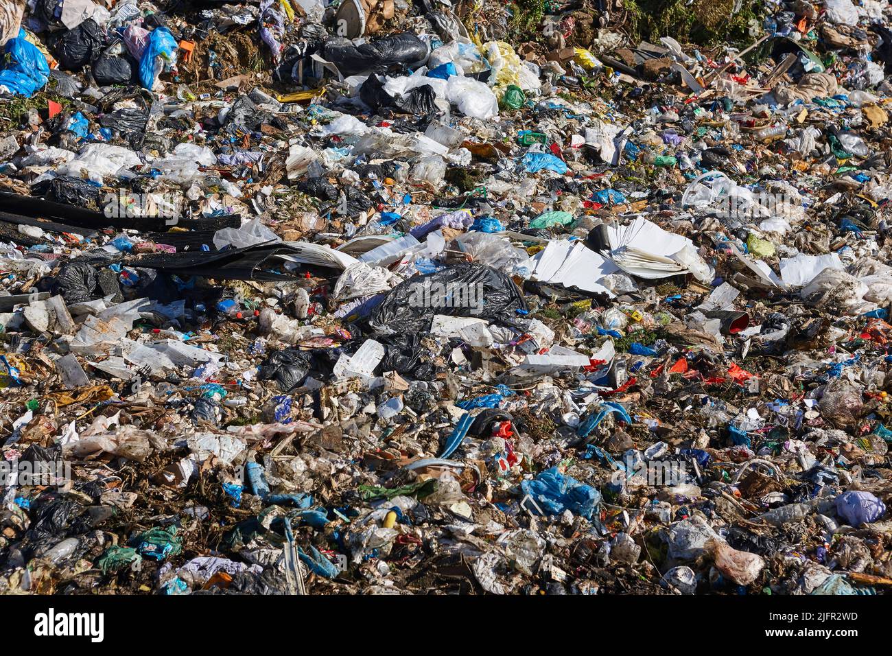 Open air garbage dump. Plastic pollution. Recycling junk. Consumerism ...