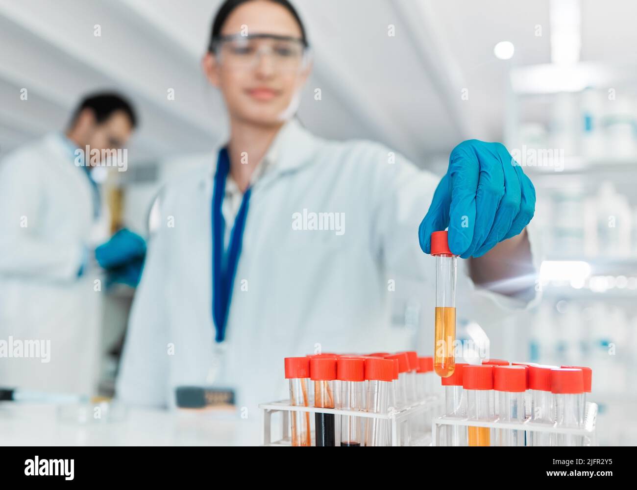 Undertaking a new controlled trial. Closeup shot of an unrecognisable ...