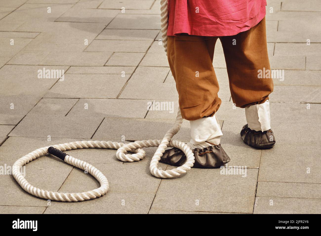 Man feet in national Russian leather shoes postol with rope Stock Photo ...