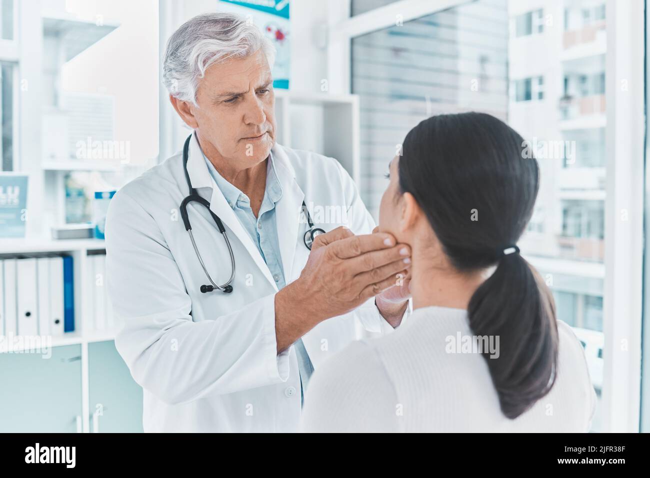 Your allergies seem to be acting up. Shot of a doctor checking a ...